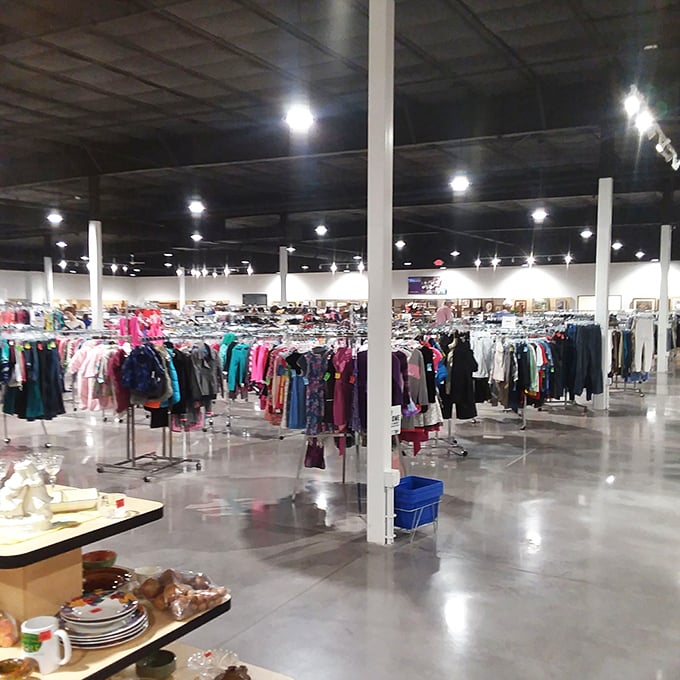 An ocean of clothing racks stretches to the horizon. If Columbus had navigated these aisles instead of the Atlantic, he'd still be shopping today.