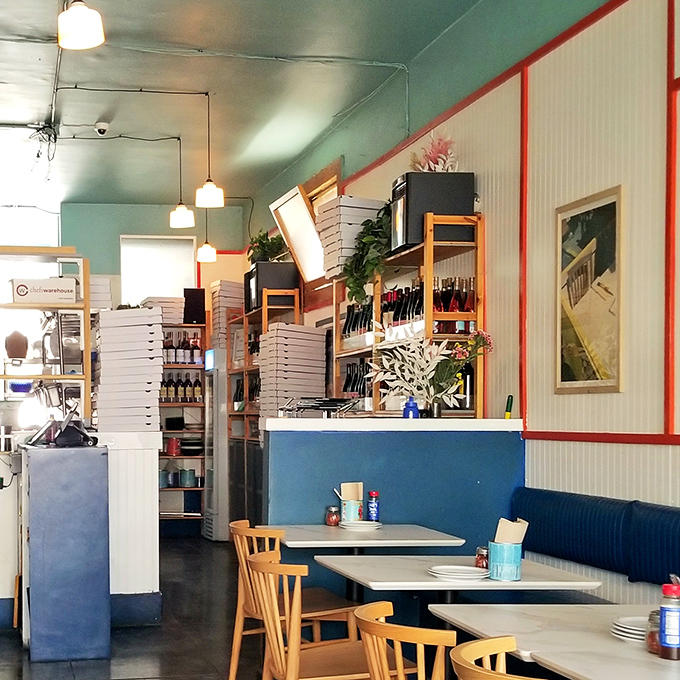 Inside, mint green walls and blue banquettes create a retro-cool vibe that says, "We're serious about pizza but not about taking ourselves too seriously."