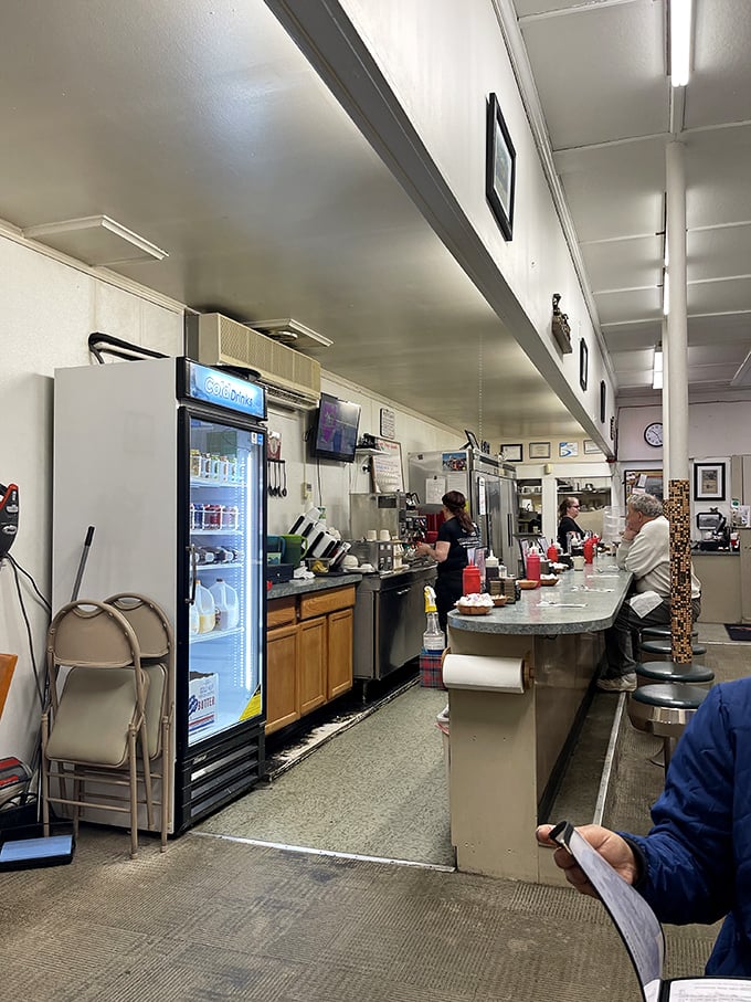 The counter where breakfast dreams come true. Notice those well-worn stools? Each one has heard thousands of "pass the syrup" requests.