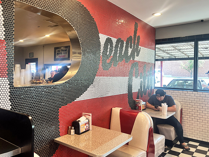 That mosaic wall isn't just decoration &ndash; it's a love letter to nostalgia, where "Ice Cream Makes Life Worthwhile" isn't just a slogan, it's a philosophy.