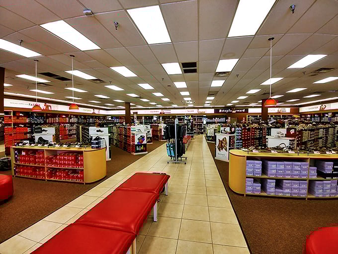 A shopper's paradise awaits inside this footwear haven, where rows of discounted sneakers and dress shoes stand ready for their forever homes.