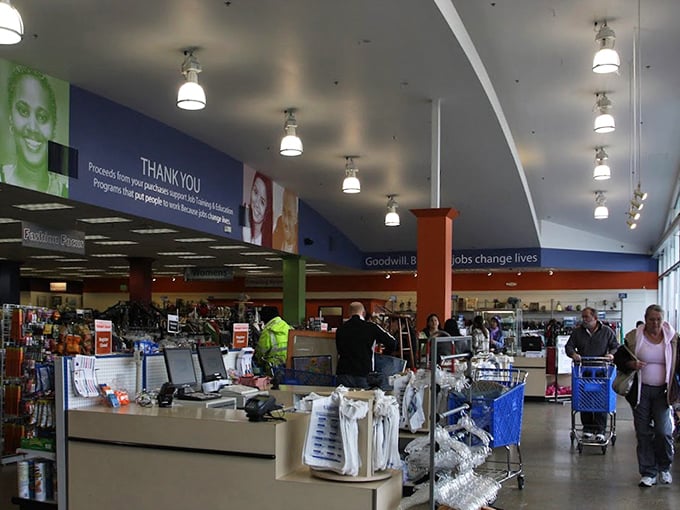 The bustling interior where shopping carts become treasure chests on wheels. That "Jobs change lives" banner reminds you this retail therapy also does good.