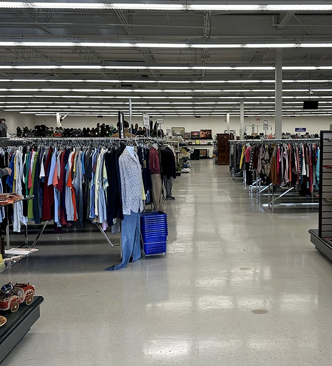 Endless racks of carefully organized clothing stretch into the distance, a thrifter's dream landscape where patience pays dividends.