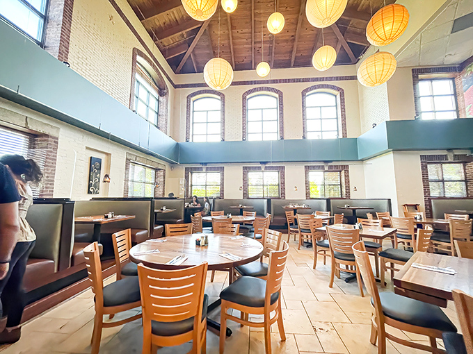High ceilings, paper lanterns, and warm wood tones create an atmosphere that says, "Stay awhile, the pancakes are worth it."