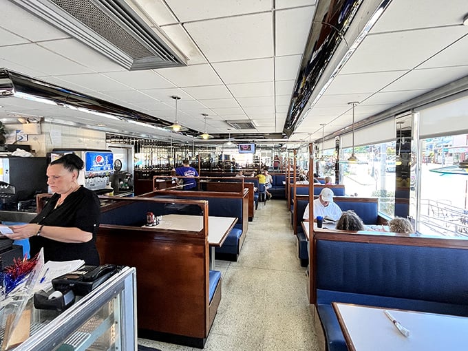 Classic blue booths line the interior like a time machine to simpler days. The counter-to-booth ratio achieves that perfect diner golden mean mathematicians dream about.