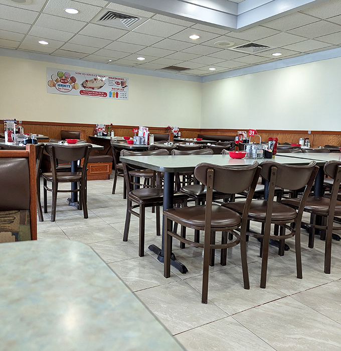 Simple wooden chairs and clean tables create that perfect diner atmosphere where conversations flow as freely as the coffee.