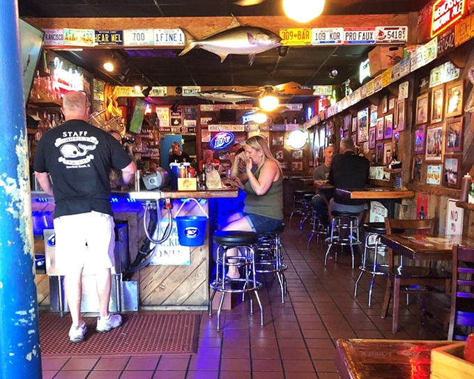 Step inside and you're transported to a seafood shrine where license plates and fishing memorabilia tell stories older than most of the patrons' grandchildren.