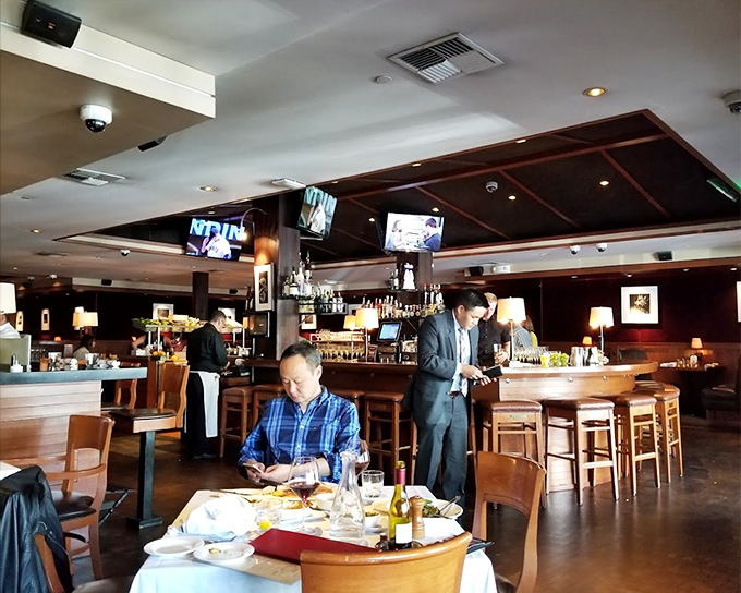 The interior strikes that perfect balance between "special occasion" and "Tuesday night dinner" with its warm wood tones and comfortable sophistication.