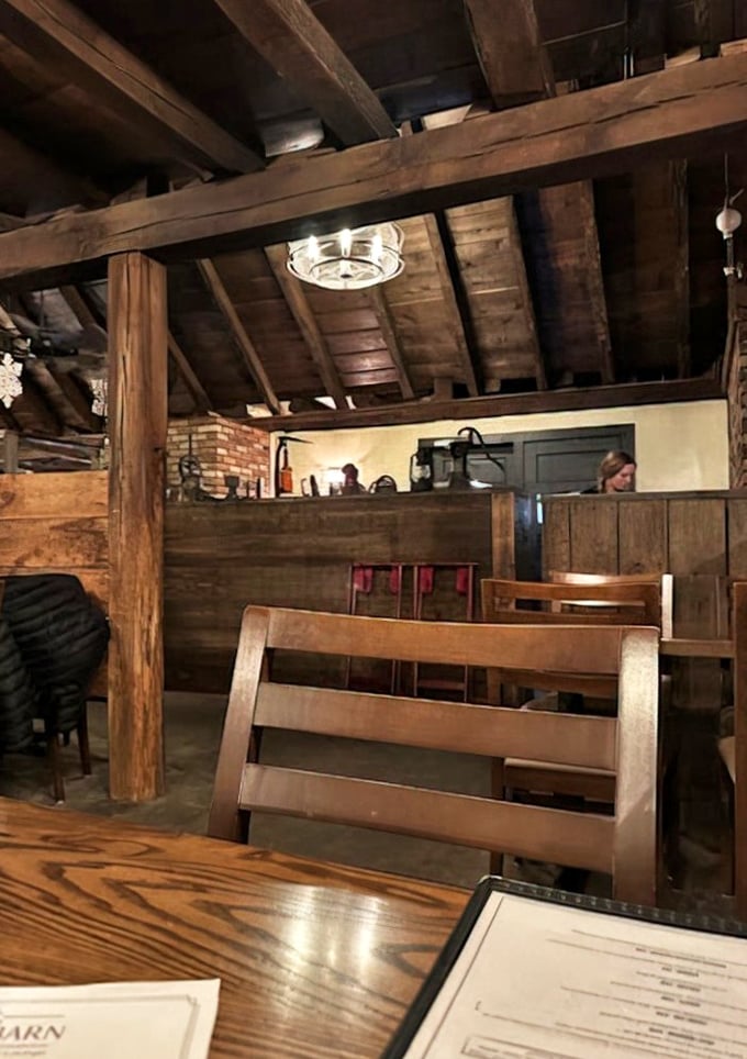 Exposed wooden beams that once housed hay now shelter hungry diners. Rural architecture never tasted so good.