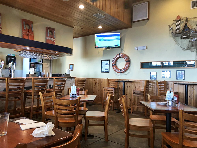 Nautical charm meets comfort at Aunt Kate's interior, where life preservers on the wall remind you you're about to be saved from ordinary dining.