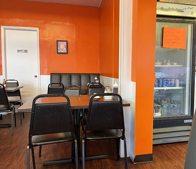 The interior's vivid orange walls could wake you up faster than the coffee. Simple, functional, and somehow making everything taste better.