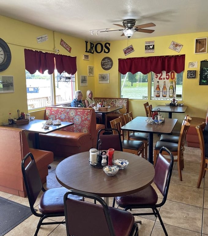 Step inside and you're transported to a cozy diner where yellow walls and burgundy accents create the perfect backdrop for breakfast bliss.