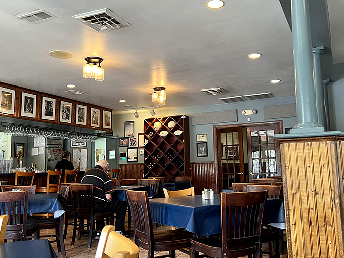 Inside, wooden chairs and classic photographs create that rare atmosphere where both first dates and family reunions feel equally at home. Wine rack included &ndash; because comfort food deserves good company.