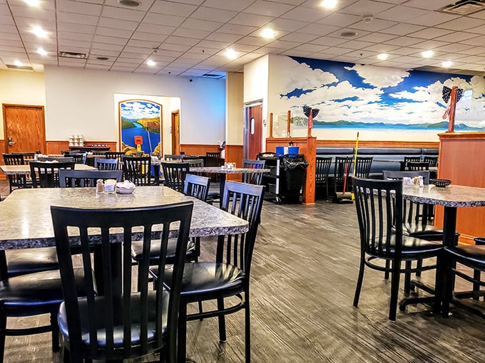 The spacious interior features a stunning blue sky mural that makes every meal feel like a picnic, minus the ants and unpredictable weather.