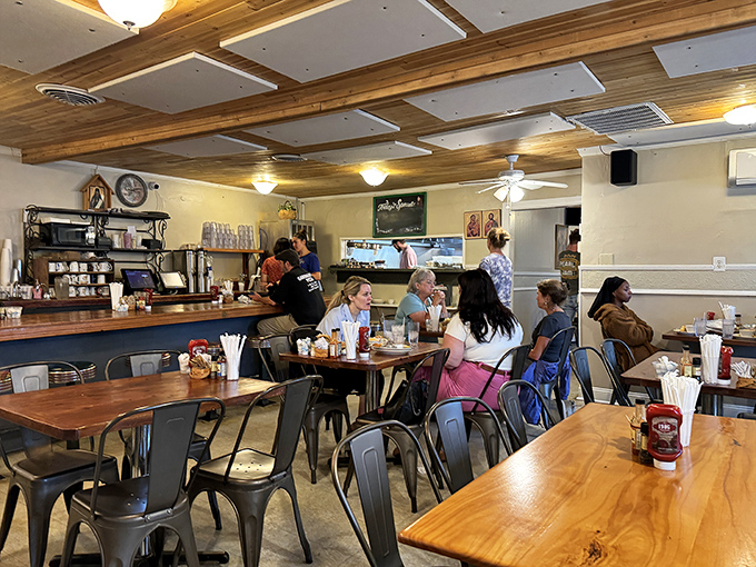 Inside, wooden beams and warm lighting create the perfect backdrop for what many consider a religious experience with eggs and coffee.