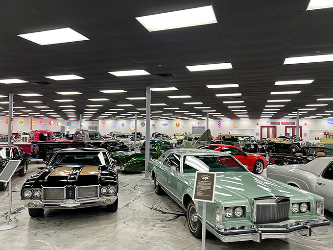 Automotive heaven doesn't have pearly gates, just fluorescent lights illuminating a sea of vintage metal where every car tells a different American story.