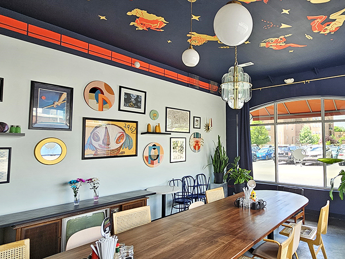 Step inside and you're transported to a retro-futuristic wonderland where the deep blue ceiling makes you feel like you're dining among the stars.