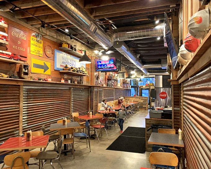 Industrial-chic meets Southern comfort in Big's interior. Corrugated metal, vintage signs, and exposed beams create the perfect backdrop for chicken euphoria.