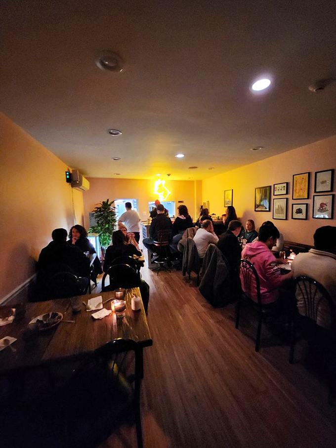 Warm yellow walls and wooden tables create that perfect "cozy, not cramped" atmosphere where conversations flow as freely as the delicious food.