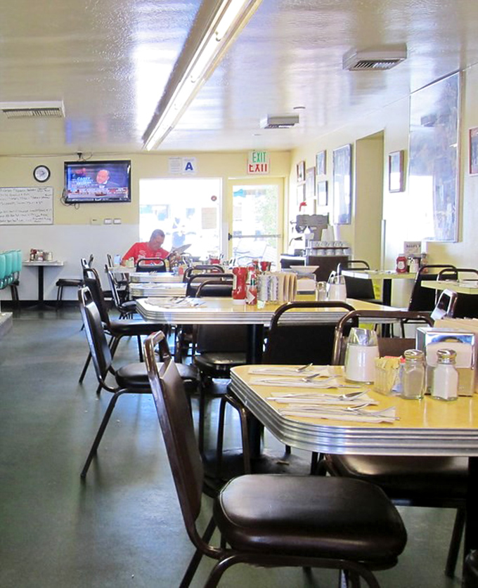 Step inside to a world where yellow Formica tables have witnessed more honest conversations than a therapist's office, and breakfast is serious business.
