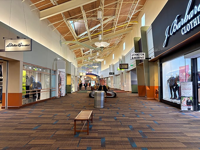 Exposed wooden beams and natural light transform what could be a fluorescent retail dungeon into something more akin to a sophisticated shopping lodge.