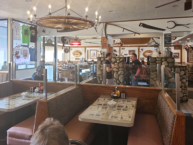 That wagon wheel chandelier isn't trying to be ironic&mdash;it's been witnessing breakfast triumphs and road trip stories for generations in Jack's warm, wood-paneled dining room.