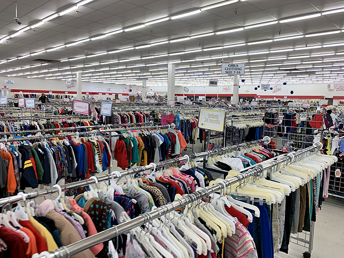 A sea of clothing racks stretches to the horizon, promising fashion adventures for the intrepid thrift explorer.
