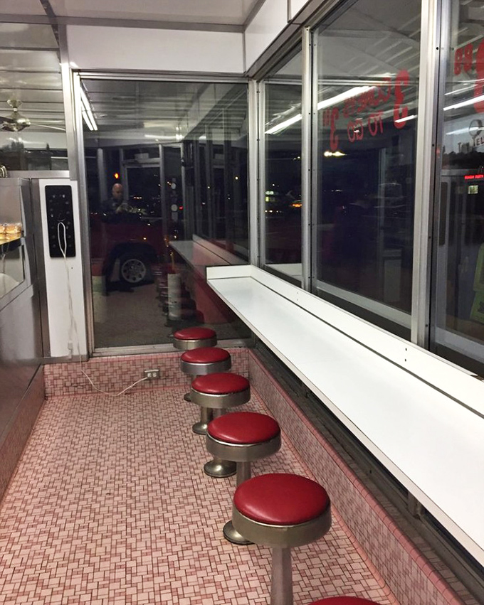 Inside, the iconic pink-tiled floor and row of red vinyl stools have witnessed decades of late-night conversations and early morning coffee breaks.