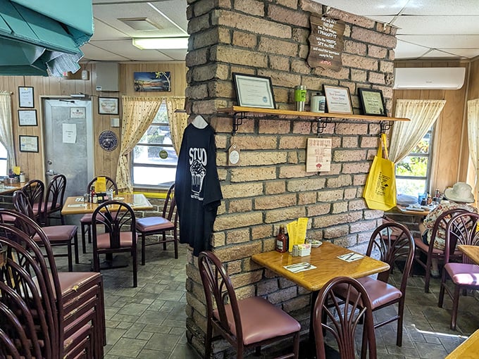 Inside, the brick column centerpiece anchors a dining room where breakfast dreams come true and t-shirts commemorate countless satisfied appetites.