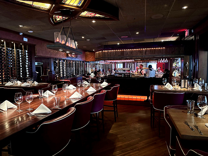 Dark wood and intimate lighting create that classic steakhouse atmosphere where serious eating happens without the stuffiness.