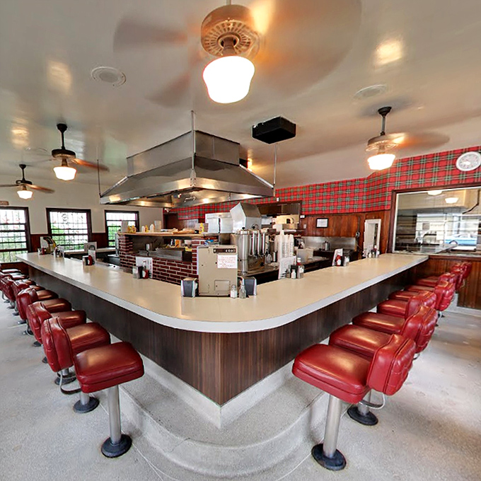 The horseshoe-shaped counter with its iconic red vinyl stools isn't just seating&mdash;it's front-row tickets to culinary theater that's been running since 1947.