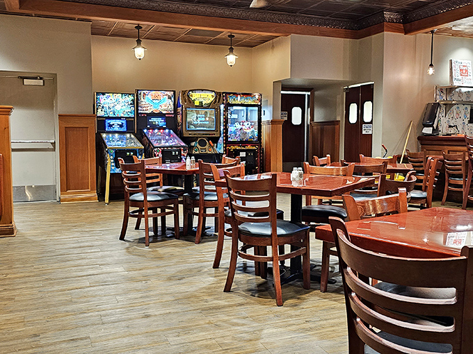 Step inside to discover a cozy dining area where arcade games wait to entertain while your stomach anticipates the main event.