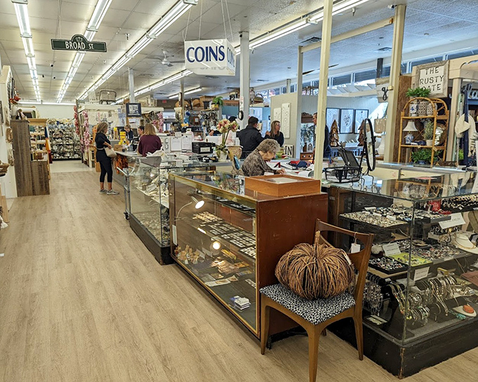 Where modern commerce meets vintage charm. That "COINS" sign might as well say "Danger: Wallet Emptying Zone Ahead." 