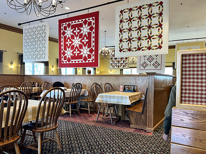 Handcrafted Amish quilts hang like colorful sentinels above the dining room, turning a simple meal into a cultural experience.