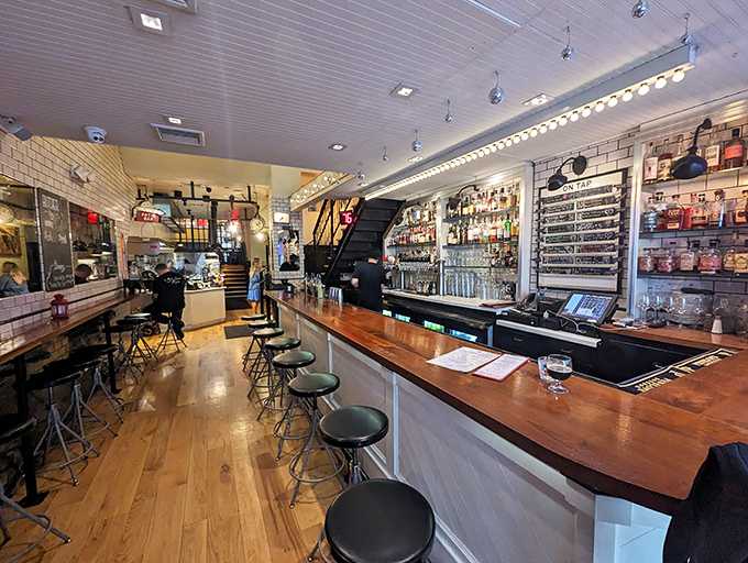 Industrial-chic meets butcher shop elegance – wooden bar tops, subway tiles, and a well-stocked bar create the perfect backdrop for serious meat appreciation.