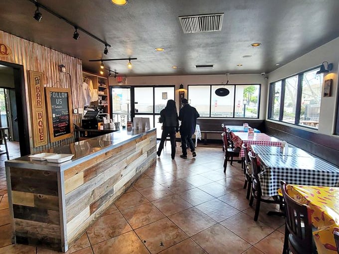 Inside, rustic wood paneling and checkered tablecloths create that perfect "focus-on-the-food" atmosphere where memorable meals and conversations happen without pretension.