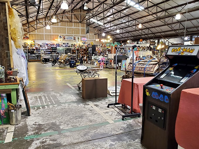 A Pac-Man arcade machine stands sentinel in this treasure hunter's paradise. Some come for furniture, others for the chance to gobble digital dots once more.