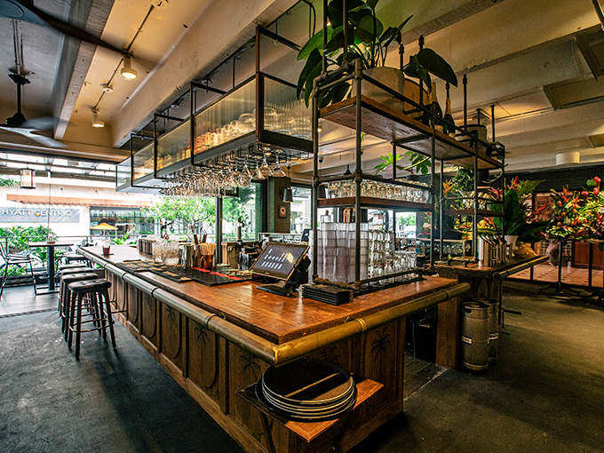 Modern elegance meets island warmth in a dining room where every detail whispers "you're in for something memorable."