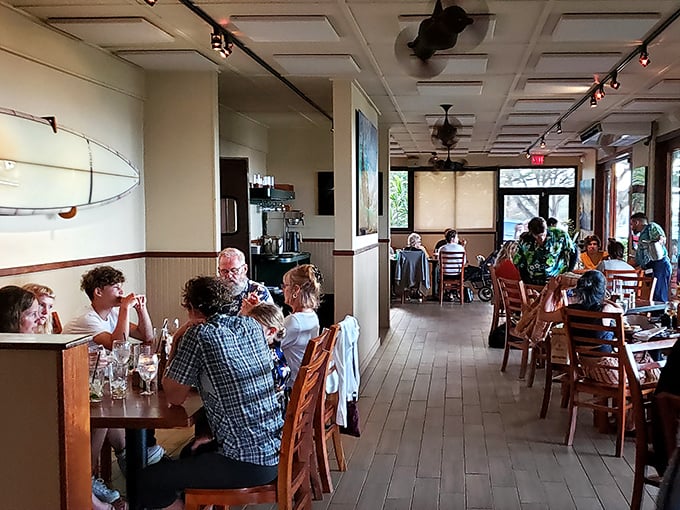 Where surfboards meet satisfied diners. The wooden floors have witnessed countless "first bite" moments that turn mainland visitors into lifelong fans.