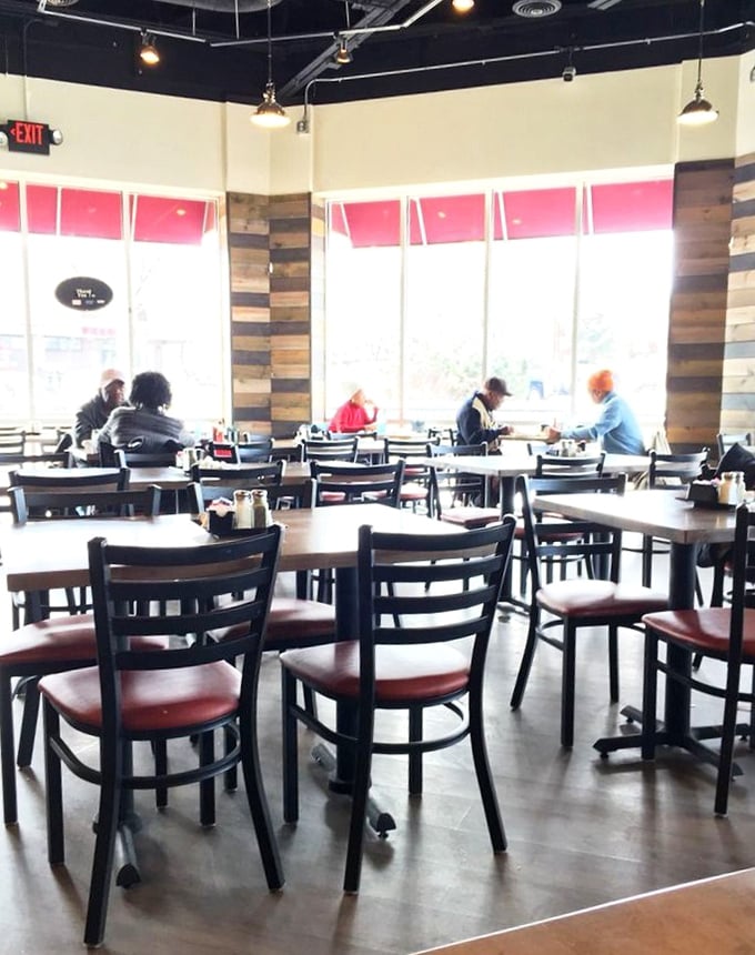 Morning sunshine streams through large windows, illuminating a dining room where breakfast dreams come true and coffee cups never stay empty.