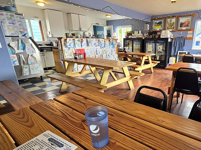 Simple wooden tables and picnic-style seating create that perfect casual vibe where the only thing fancy should be the seafood on your plate.