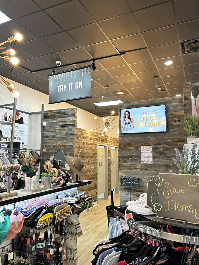 Modern rustic meets retail therapy inside, where stone accent walls and "Try It On" signs beckon fashion explorers into a world of secondhand luxury.