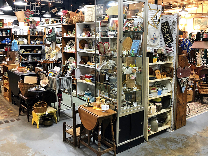 Where memories are stacked higher than Wisconsin snowdrifts. The red ANTIQUES sign serves as a beacon for nostalgia hunters.