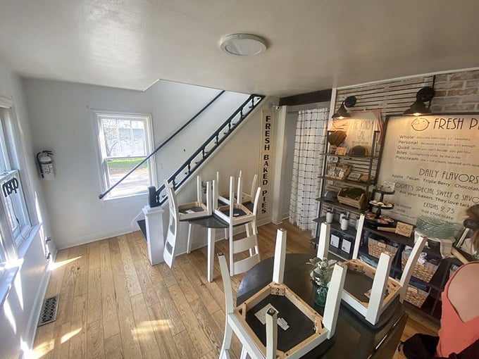 Sunlight streams through windows onto wooden floors where chairs await their next pie pilgrims. This isn't just a bakery—it's a cathedral of crust.