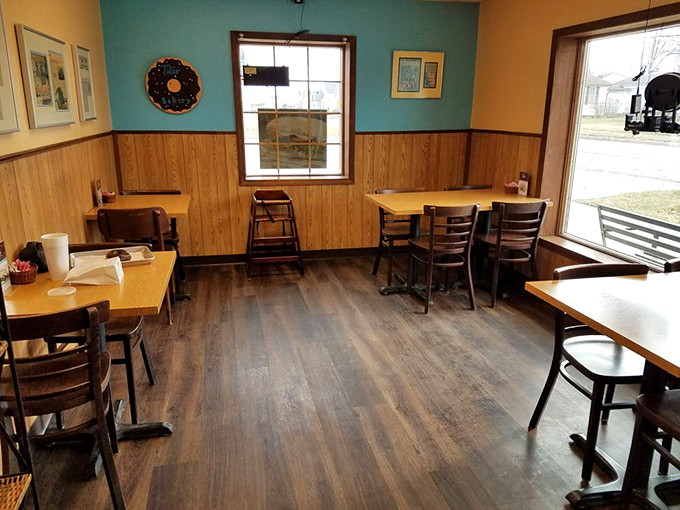 Cozy wooden paneling and turquoise walls create that rare atmosphere where calories don't count and coffee refills feel mandatory.