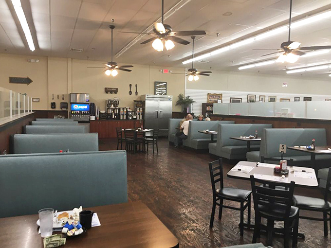 Blue vinyl booths and ceiling fans create that perfect small-town atmosphere where calories don't count and conversations flow as freely as the coffee.