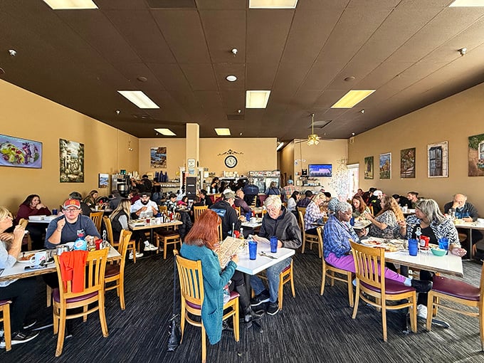 Morning sunshine streams through windows as locals pack tables. This isn't just breakfast&mdash;it's a community gathering disguised as a meal.