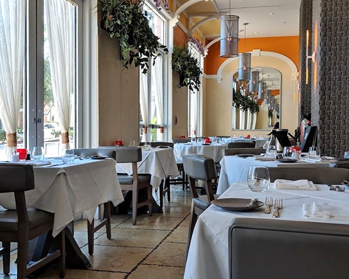 White tablecloths, soft lighting, and graceful arches create a dining room where memories are made. Elegance without pretension is the name of the game here.
