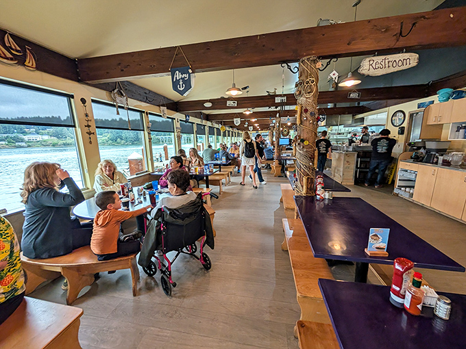 The dining room feels like the world's coziest ship cabin, where wooden beams and water views compete for your attention between bites.