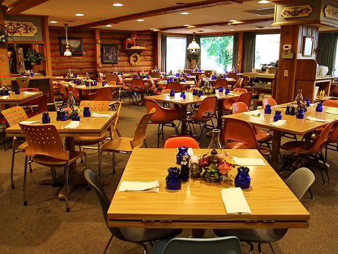 Warm wooden walls and blue glassware create a cozy Scandinavian haven. Like stepping into your Swedish grandmother's dining room&mdash;even if you don't have one.